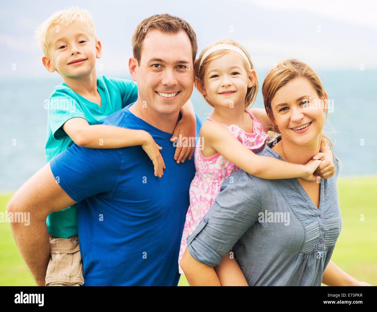 Portrait of Happy Family Outside Stock Photo - Alamy
