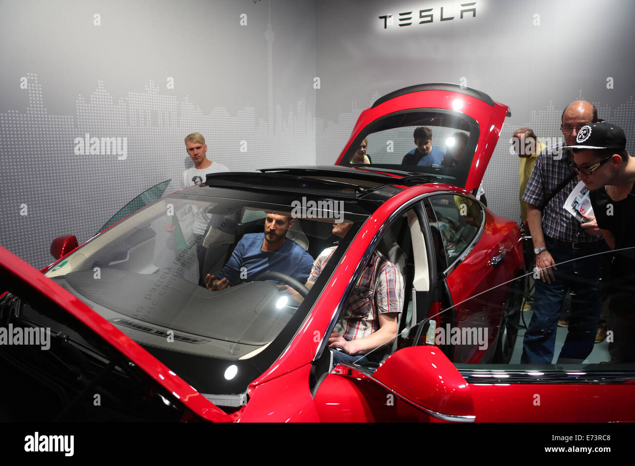 Berlin, Germany. 5th Sep, 2014. Visitors view a Tesla car during the ...