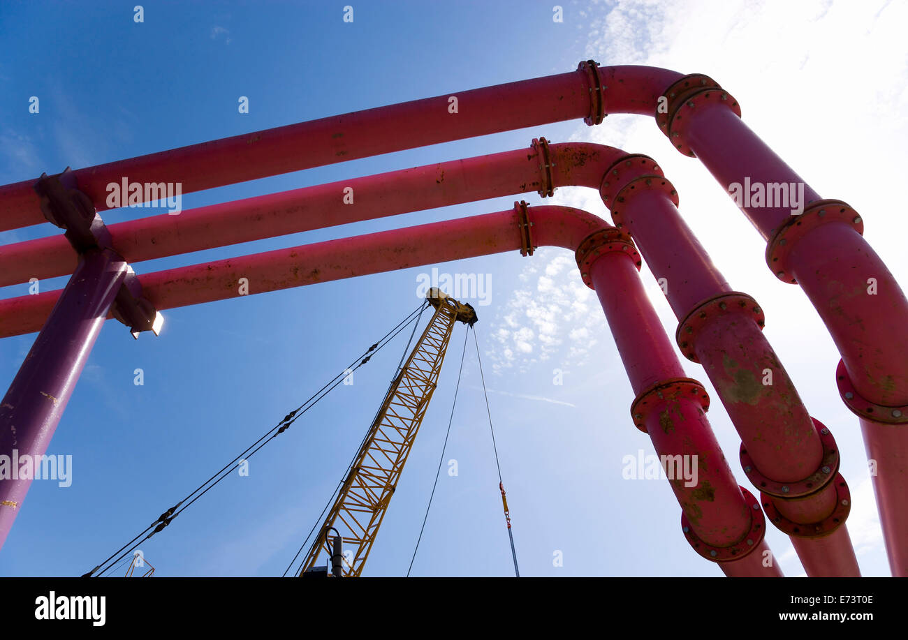 Germany, Berlin, Mitte, elevated red pipes removing water from ...