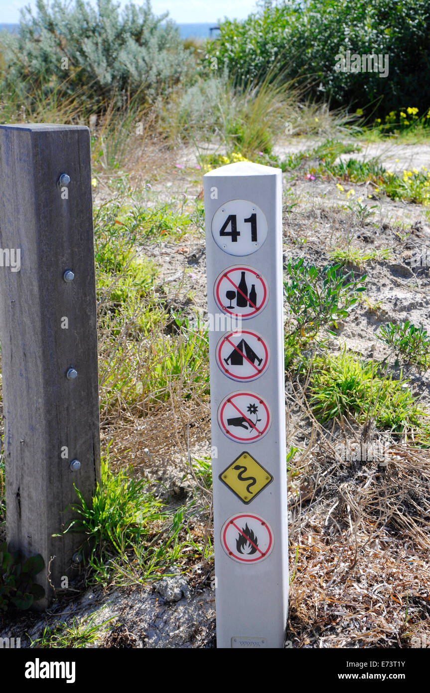 Warning sign beside natural vegetation biodiversity land along the ...