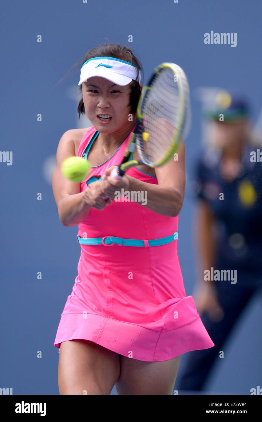 New York, USA. 5th Sep, 2014. Peng Shuai of China returns a shot to Caroline Wozniacki of ...