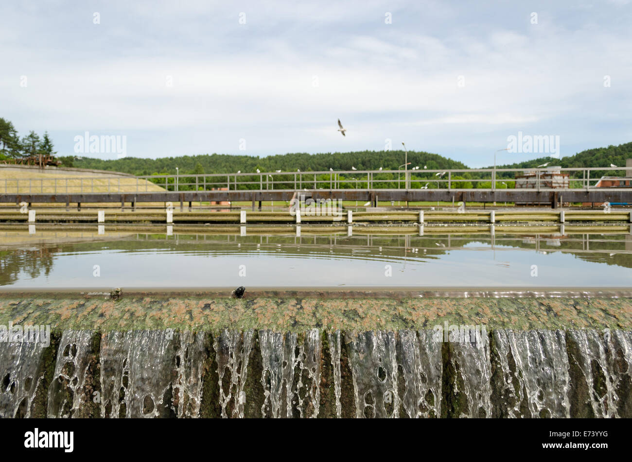 Closeup of water flow filtration sedimentation step in water treatment ...