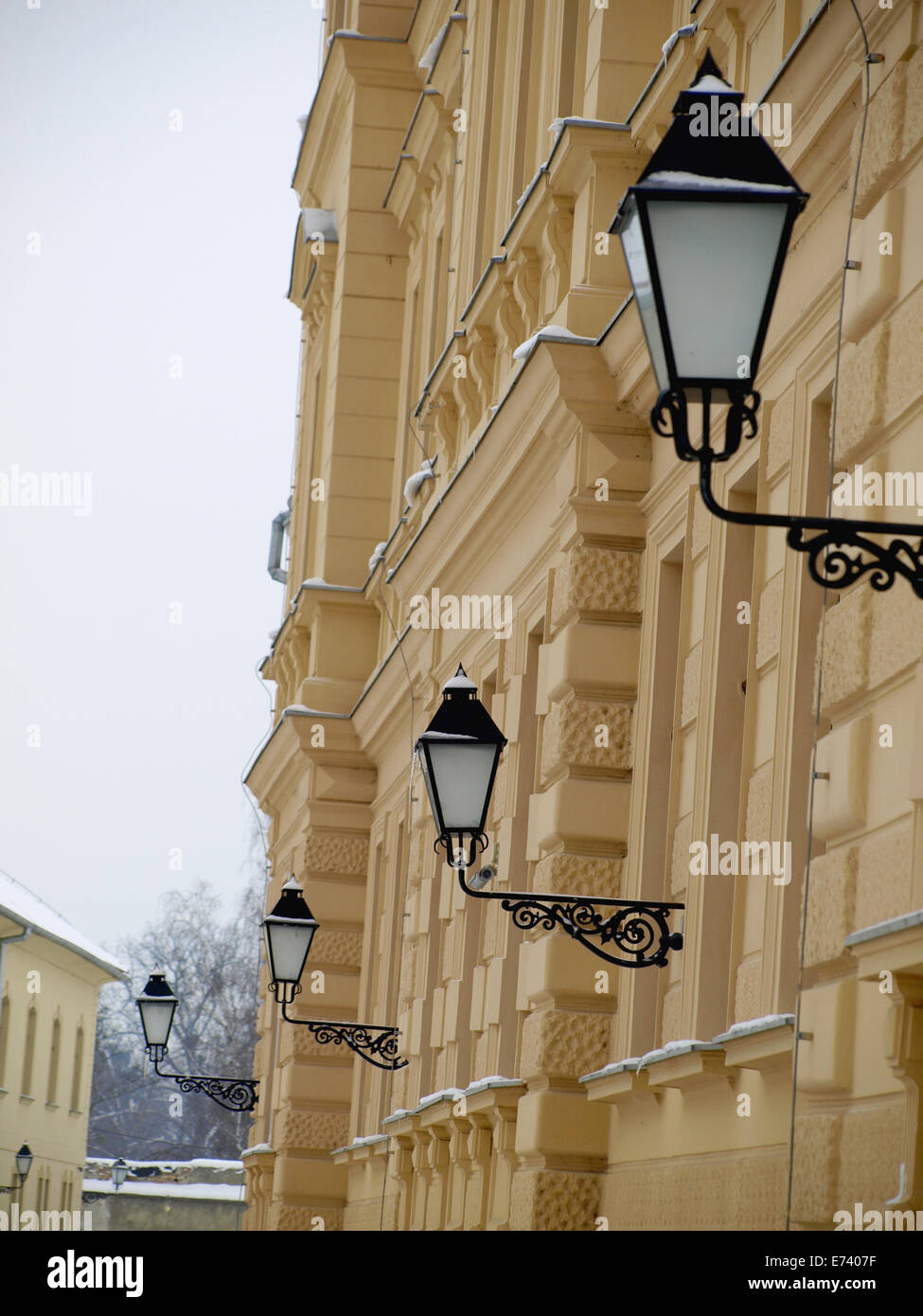 yellow building with windows and street lamp Stock Photo - Alamy