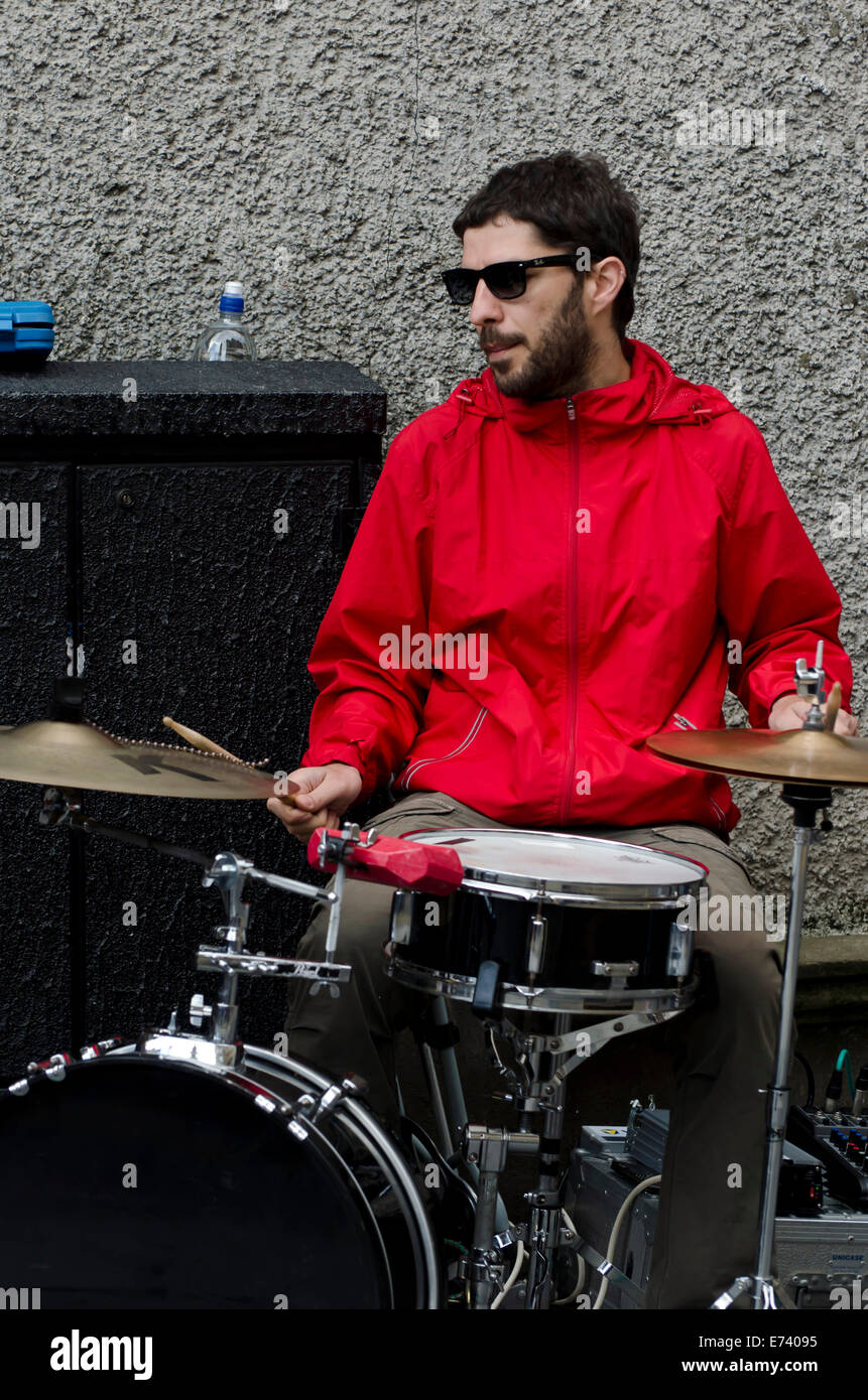 Drummer with a band busking during the annual Festival Fringe in ...