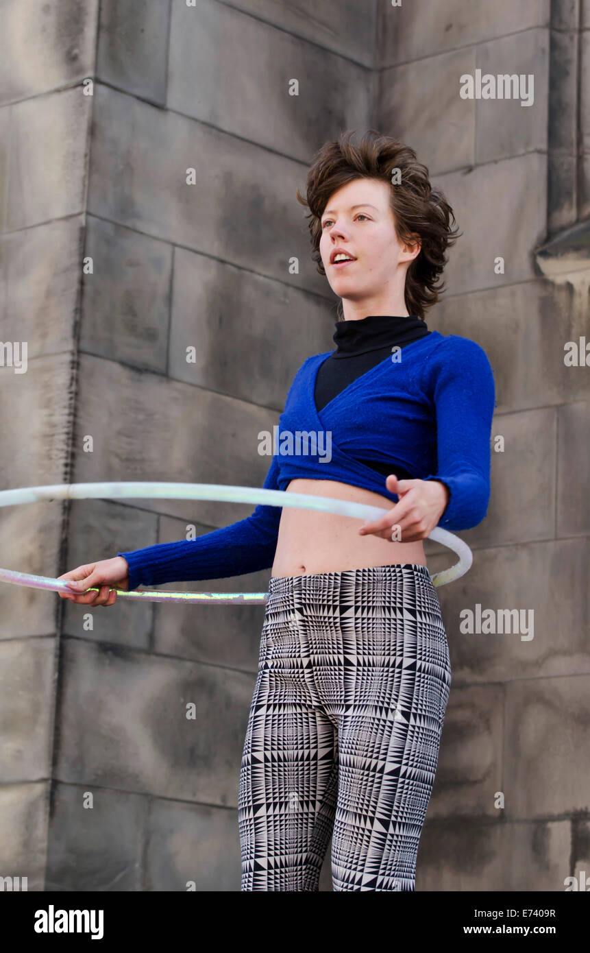 Acrobatic girl spinning a hoop performing during the annual Festival ...
