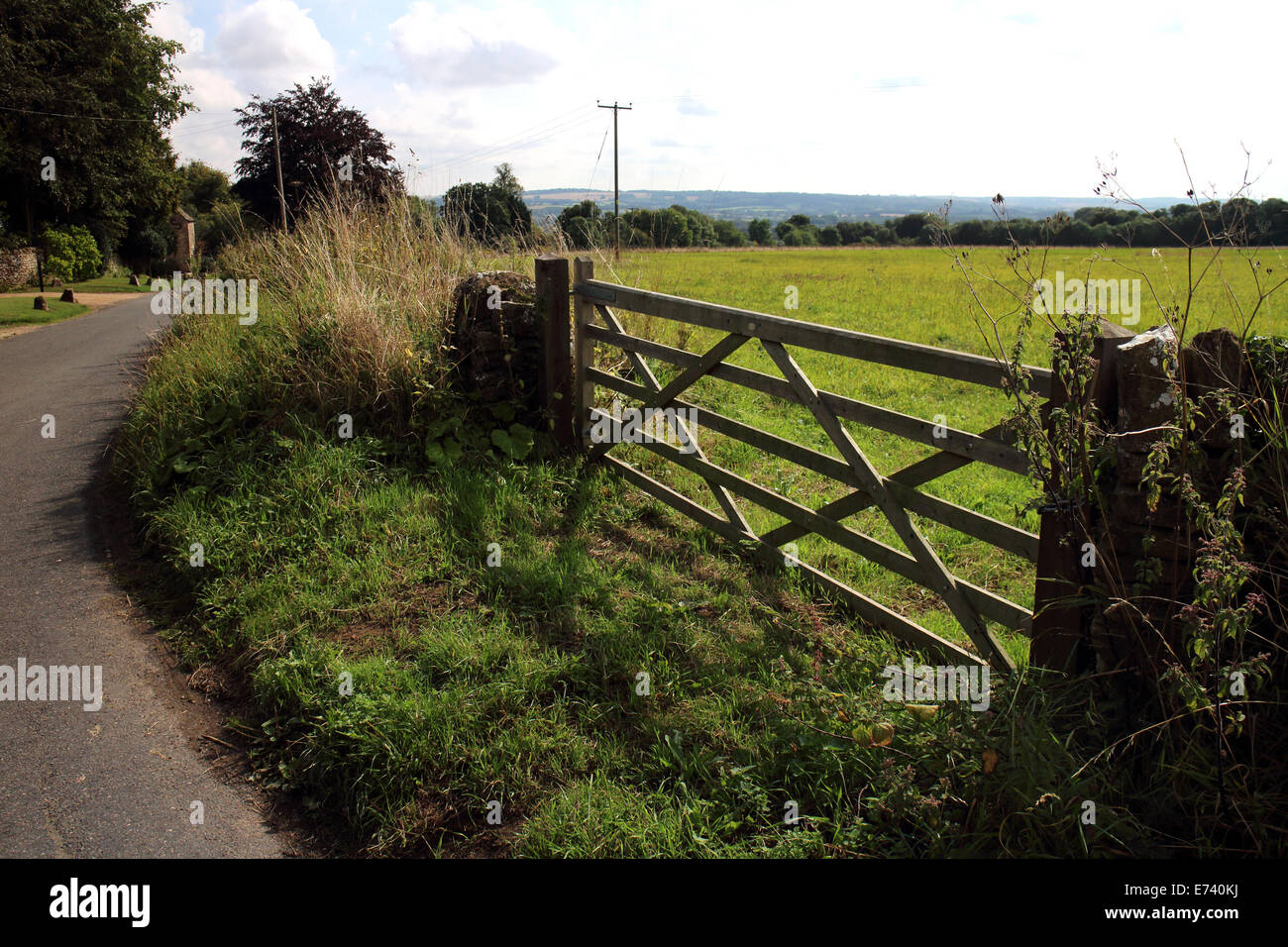 A five-barred gate in the Cotswold village of Donnington ...