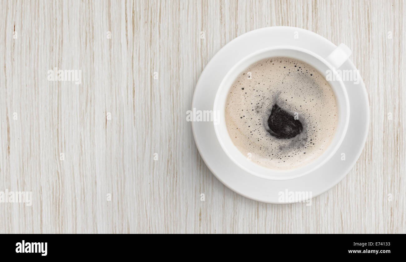 black coffee on white wooden table top view Stock Photo - Alamy