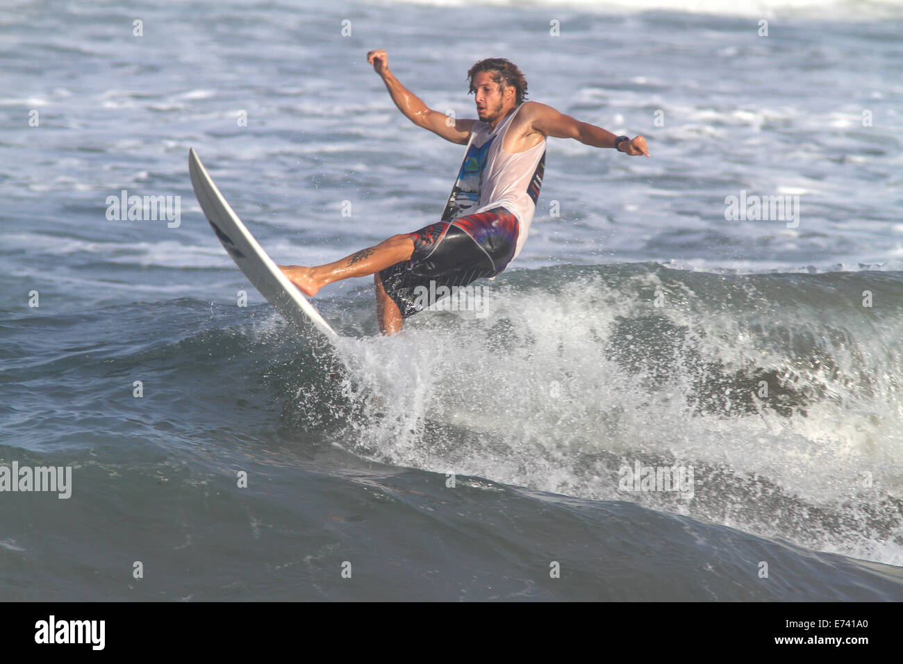 Surfing a wave Stock Photo - Alamy