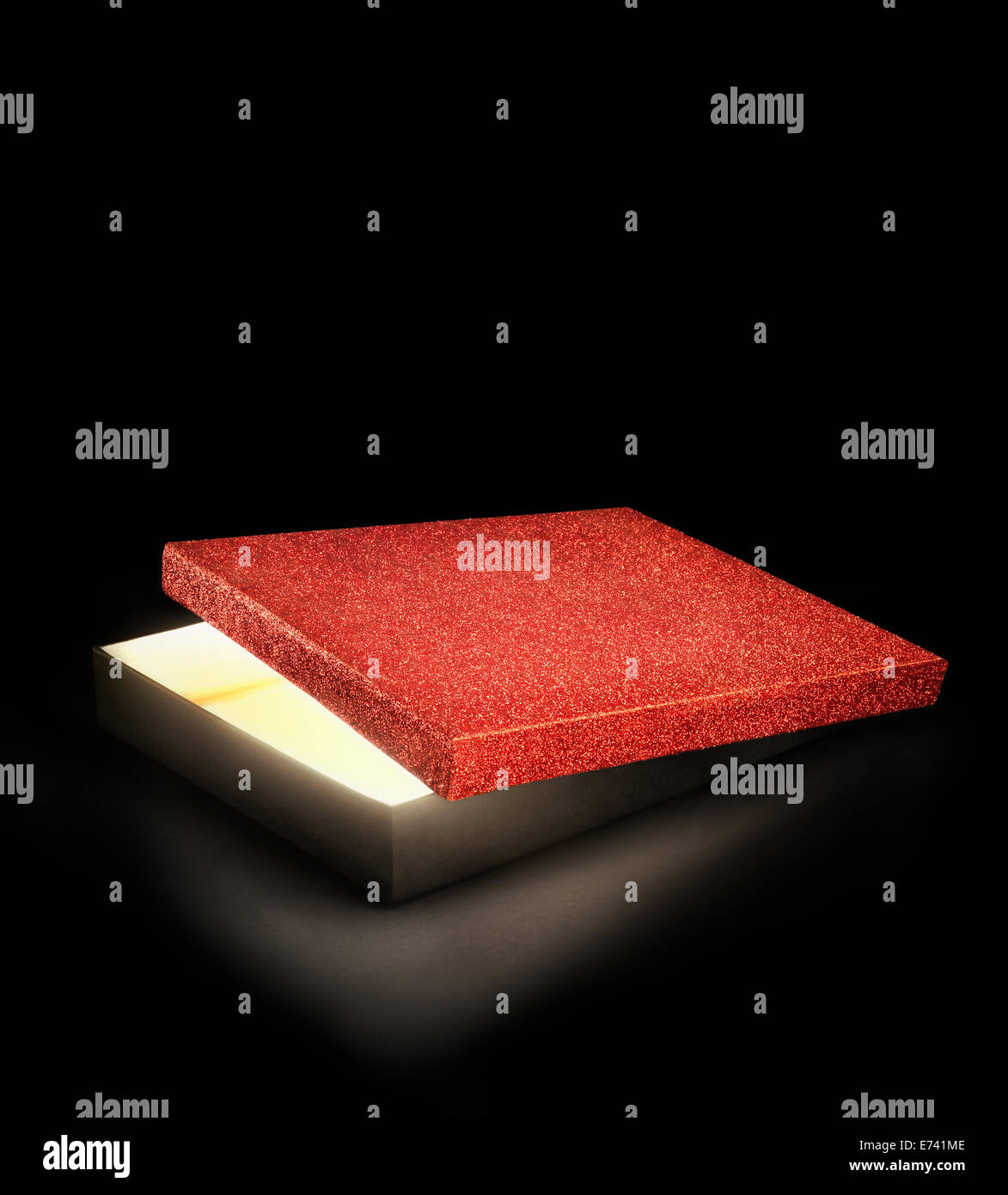 Red color gift box fantasy on black background Stock Photo - Alamy