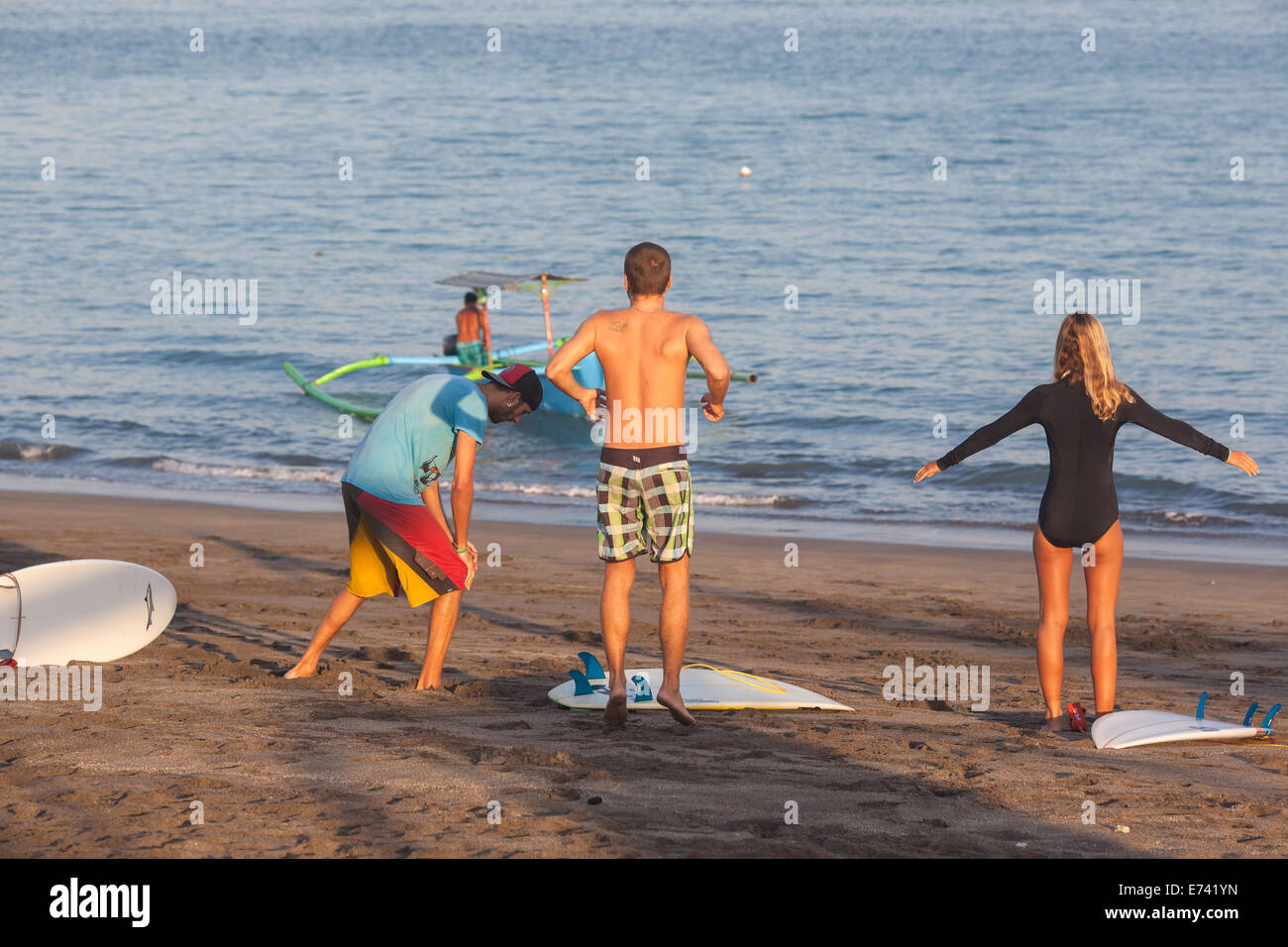 Surfers on the beach Stock Photo - Alamy