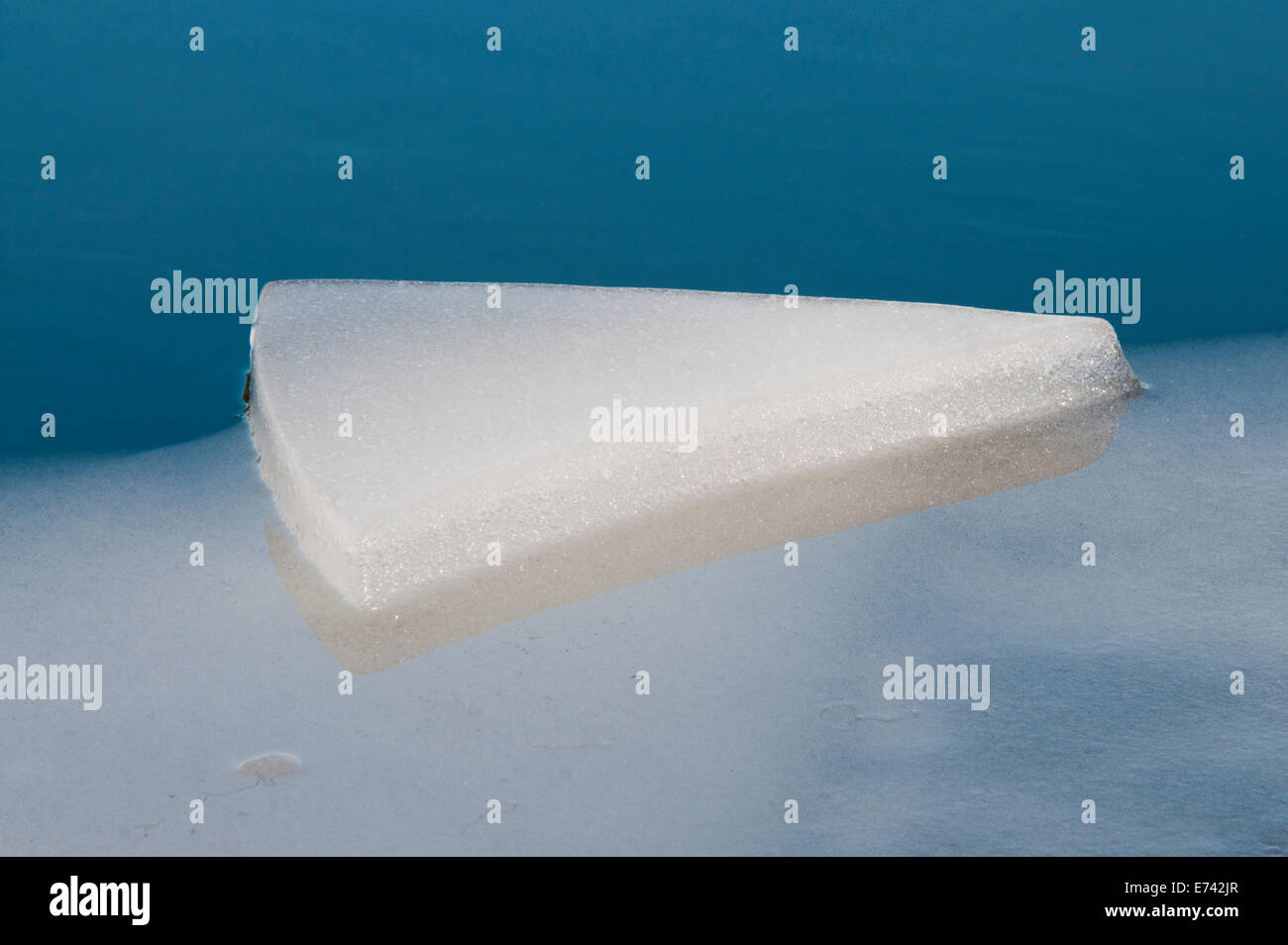 A slice of ice against a bright blue background and other ice Stock ...