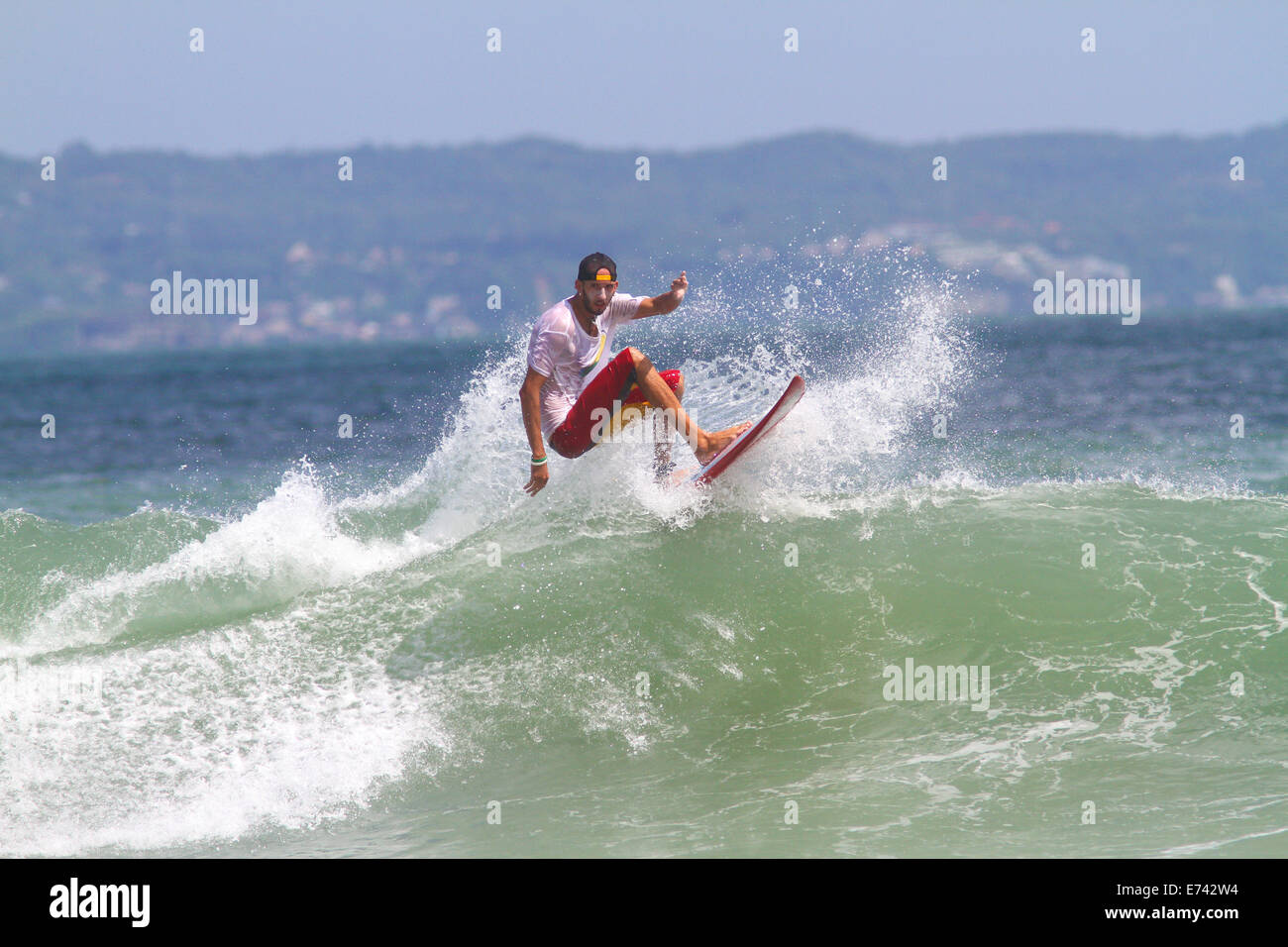 Surfing a wave Stock Photo - Alamy