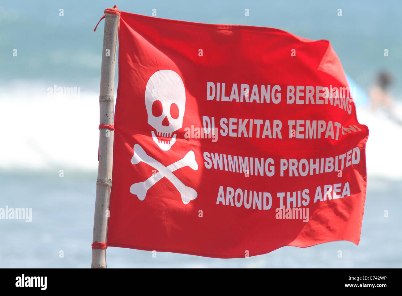 Red Flag on the Sand Beach with No Swimming Sign Stock Photo - Alamy