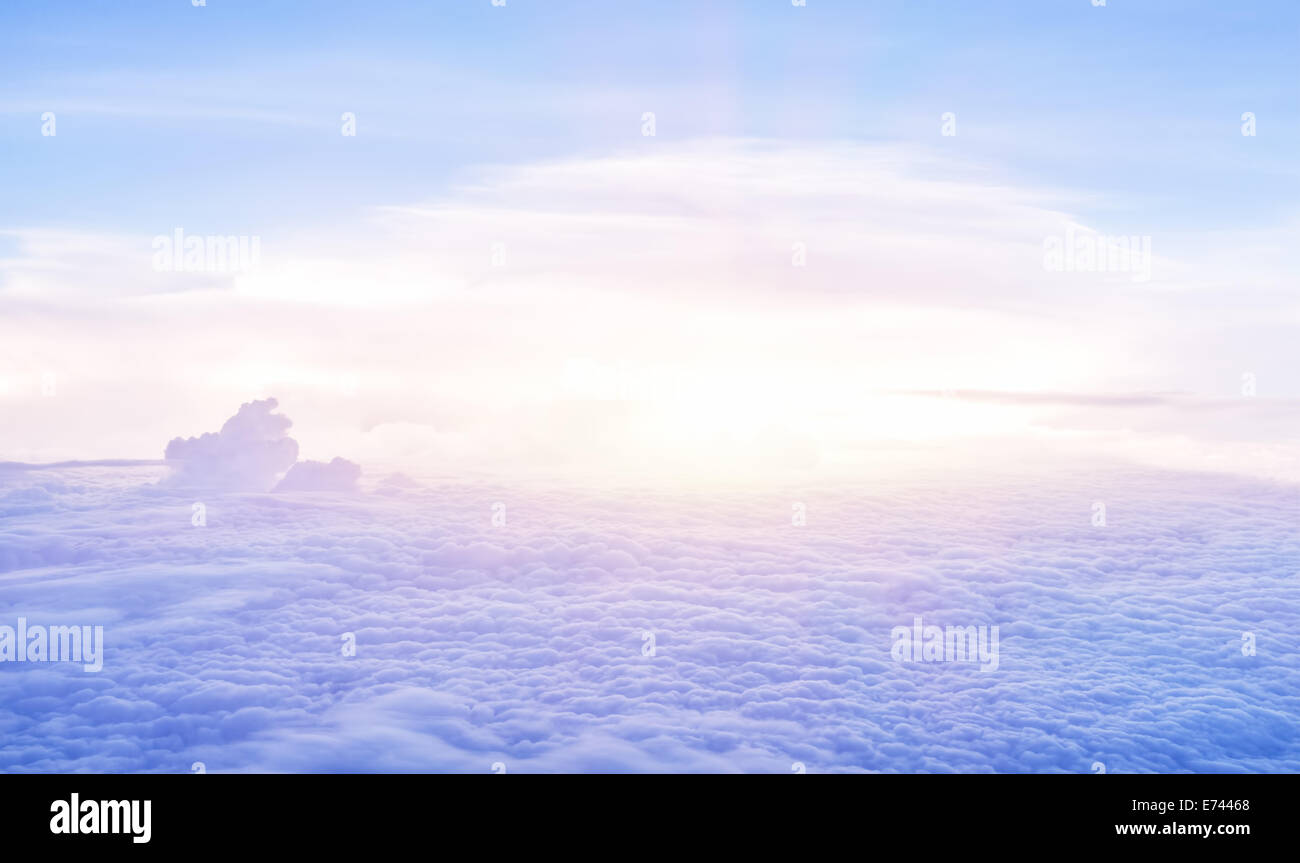 Beautiful heaven in the morning, flying over fluffy clouds, bright sun ...
