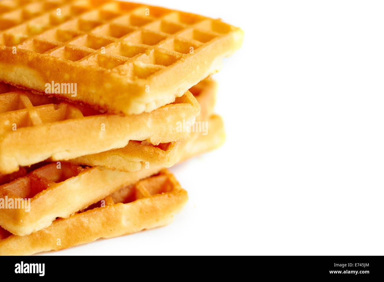Stack of belgian waffles on simple background Stock Photo - Alamy