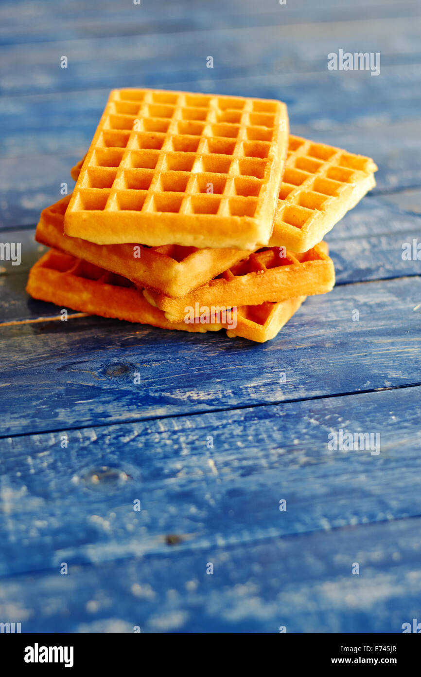 Stack of belgian waffles on simple background Stock Photo - Alamy