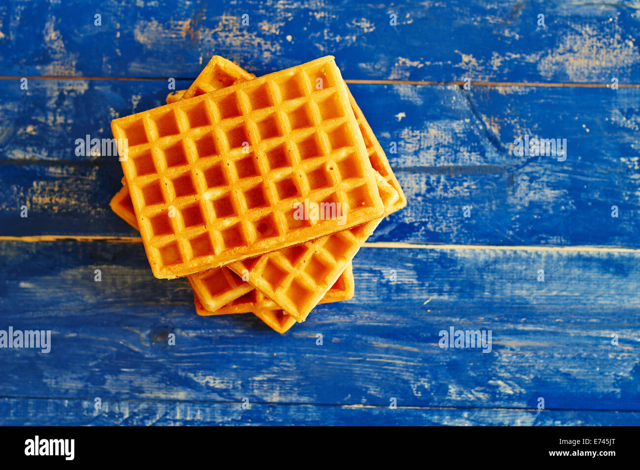 Stack of belgian waffles on simple background Stock Photo - Alamy
