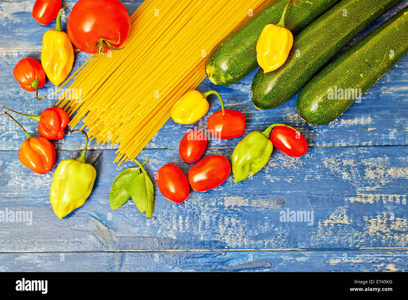 Raw spaghetti pasta with vegetables Stock Photo - Alamy
