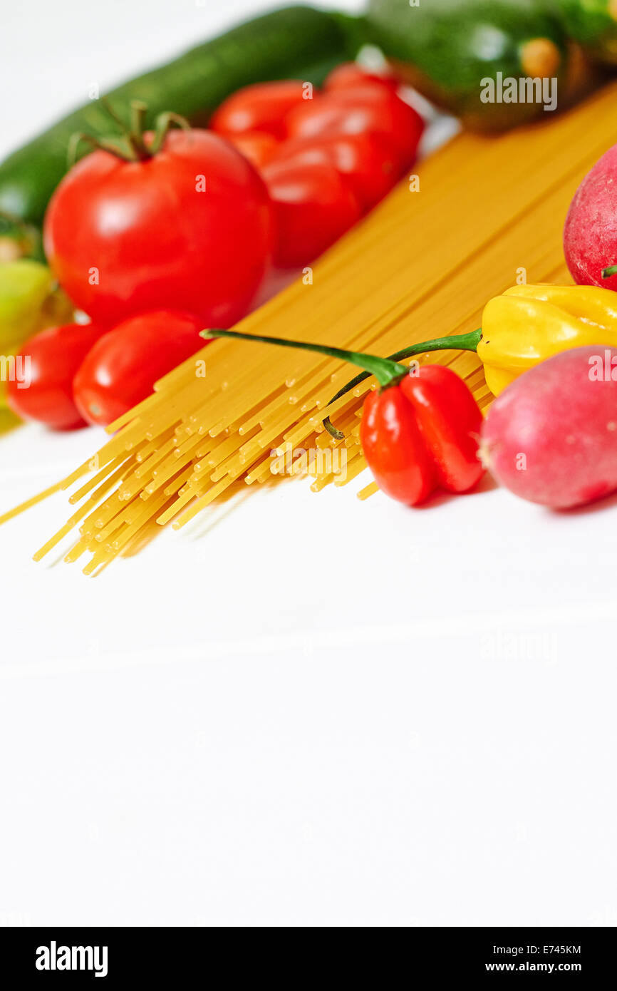 Raw spaghetti pasta with vegetables Stock Photo - Alamy