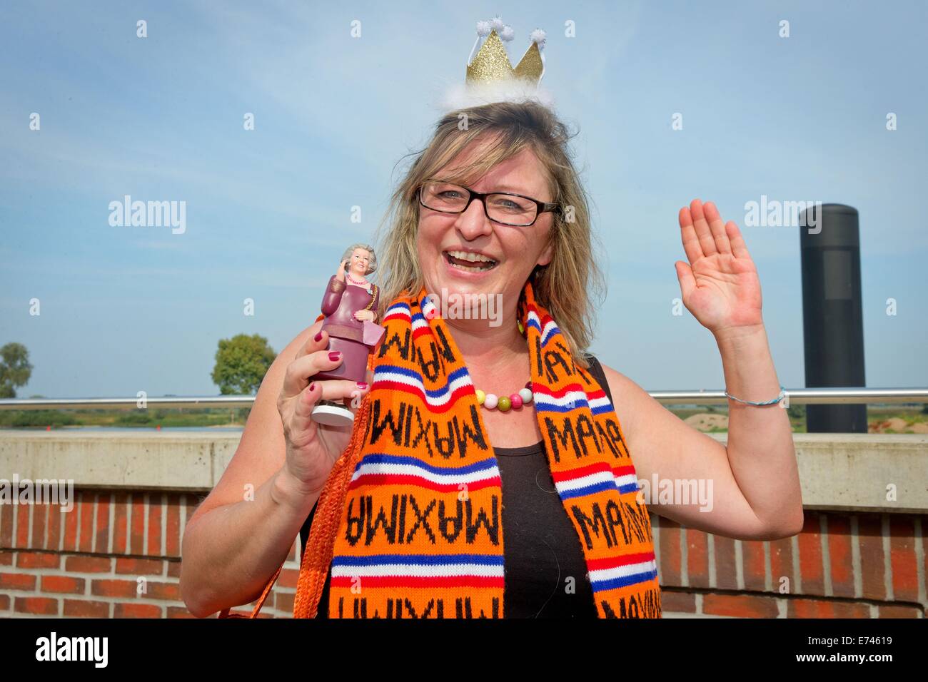 A royal fan waves as Princess Beatrix of The Netherlands opens the ...