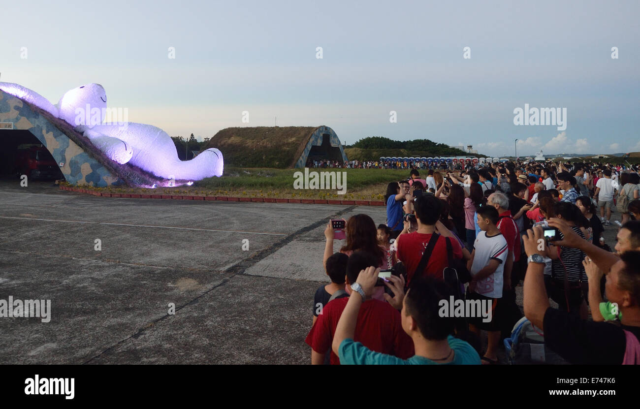 Taipei. 6th Sep, 2014. People watch a 25-meter-tall Moon Rabbit created ...