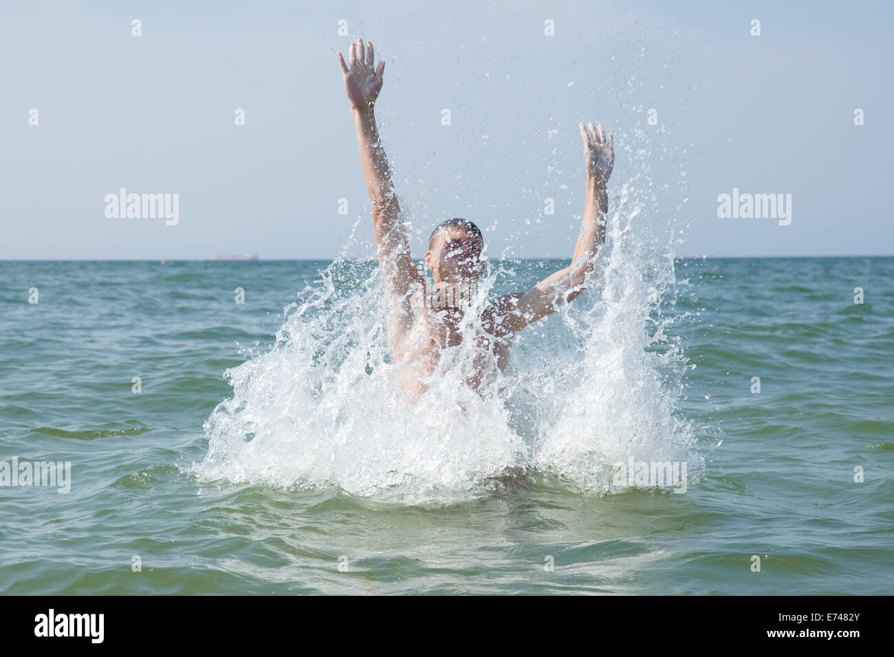 Splashing in water Stock Photo - Alamy