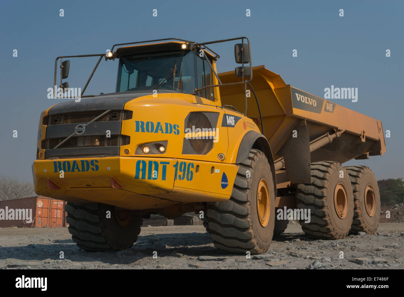 An empty Volvo mining dump truck waits in a queue to be loaded with ...
