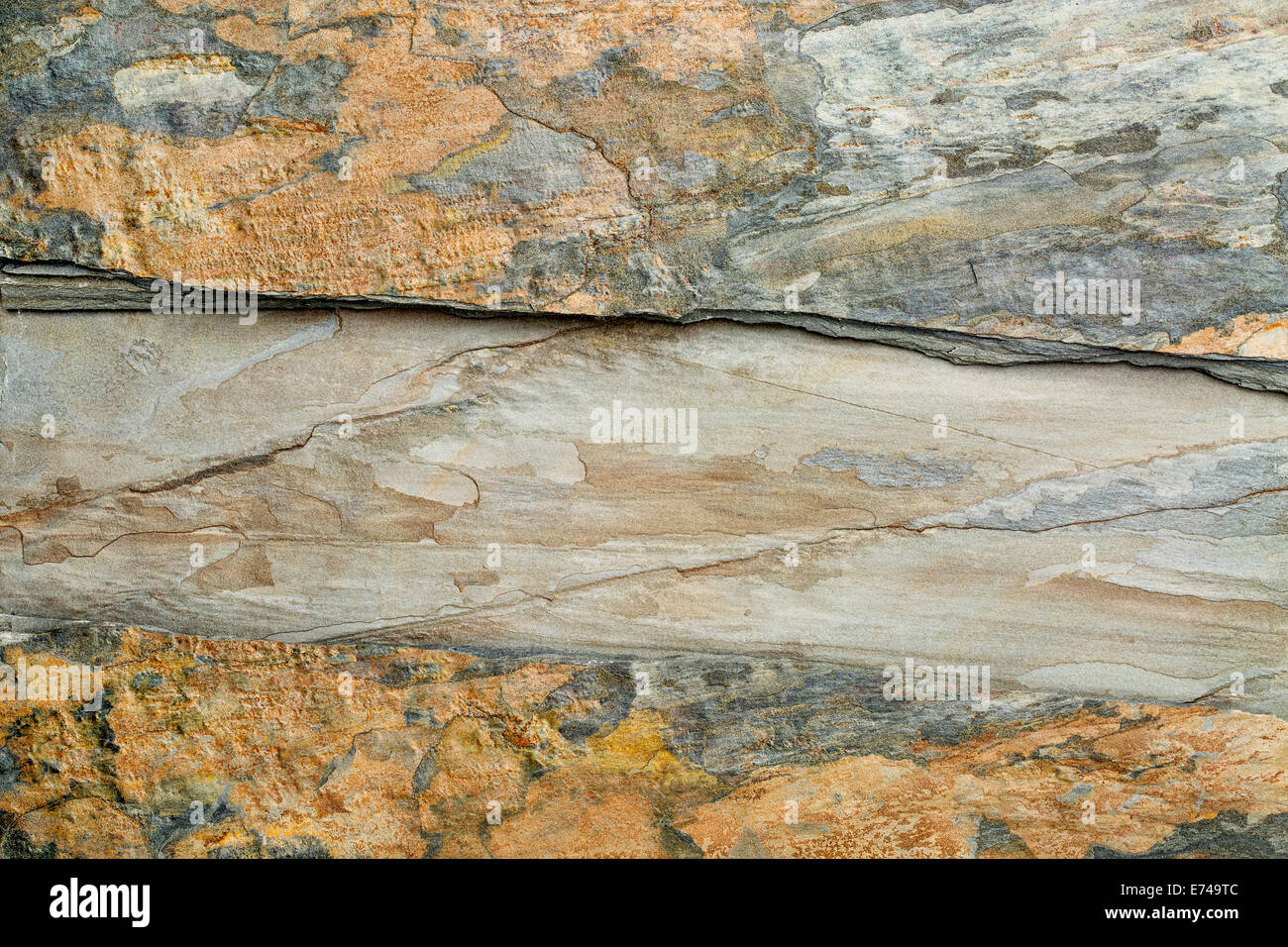 two layers of flat, multi color foliated slate rock Stock Photo - Alamy