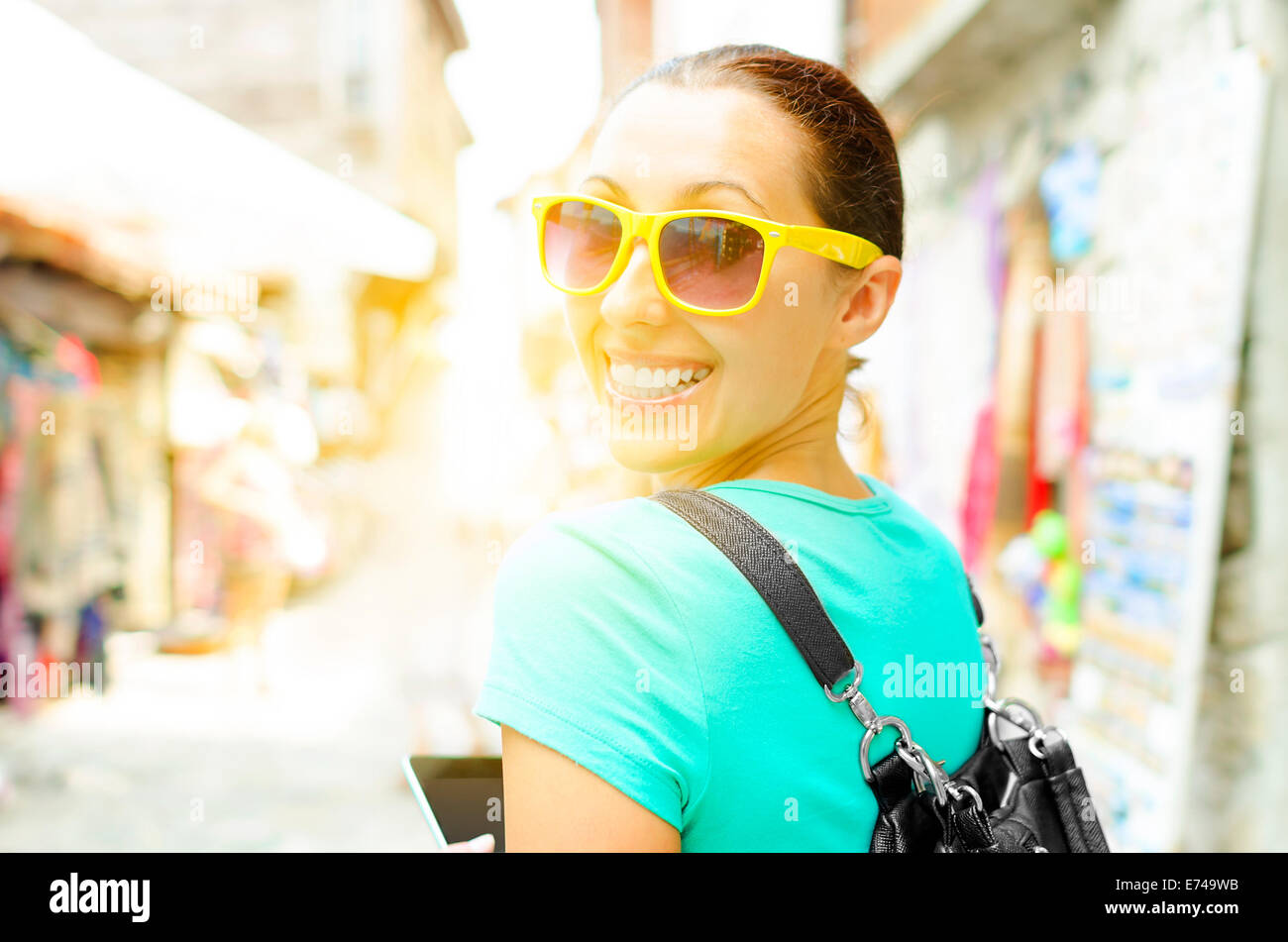 Attractive girl tourist, smiling walking outdoors Stock Photo - Alamy