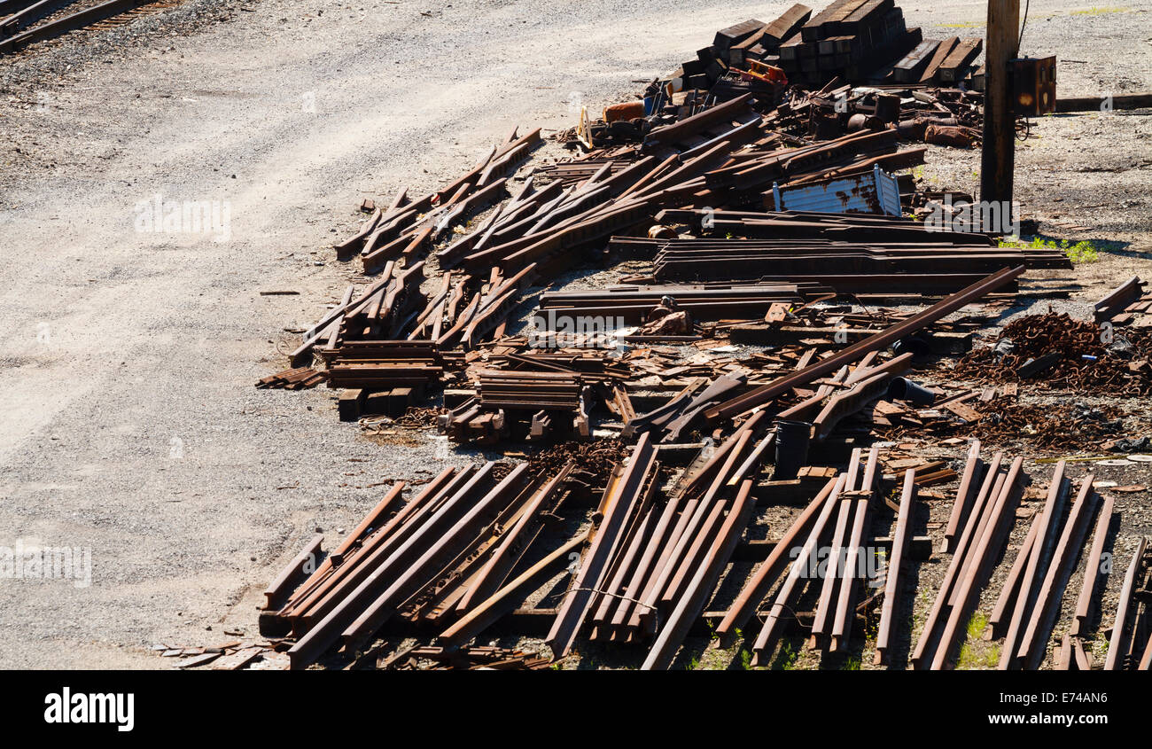 A pile of railroad industry rusty scrap metal on the edge of a railroad ...
