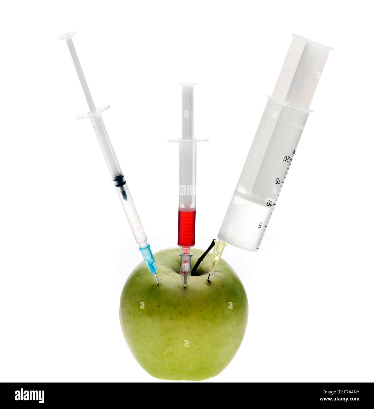 Genetic experiment with green apple Stock Photo - Alamy
