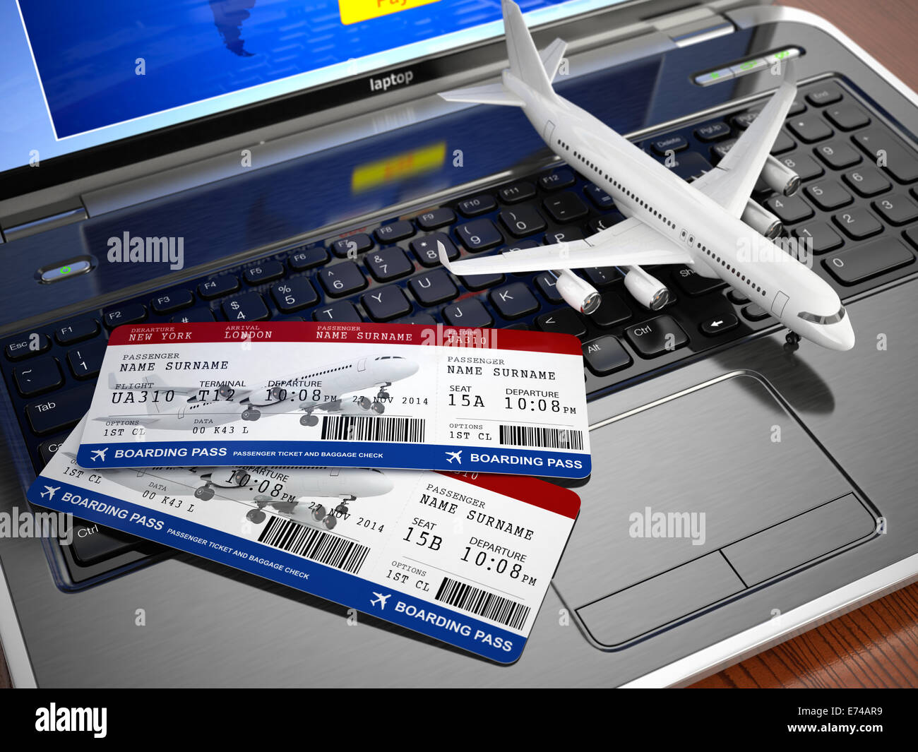 Online ticket booking. Airplane and boarding pass on laptop keyboard ...