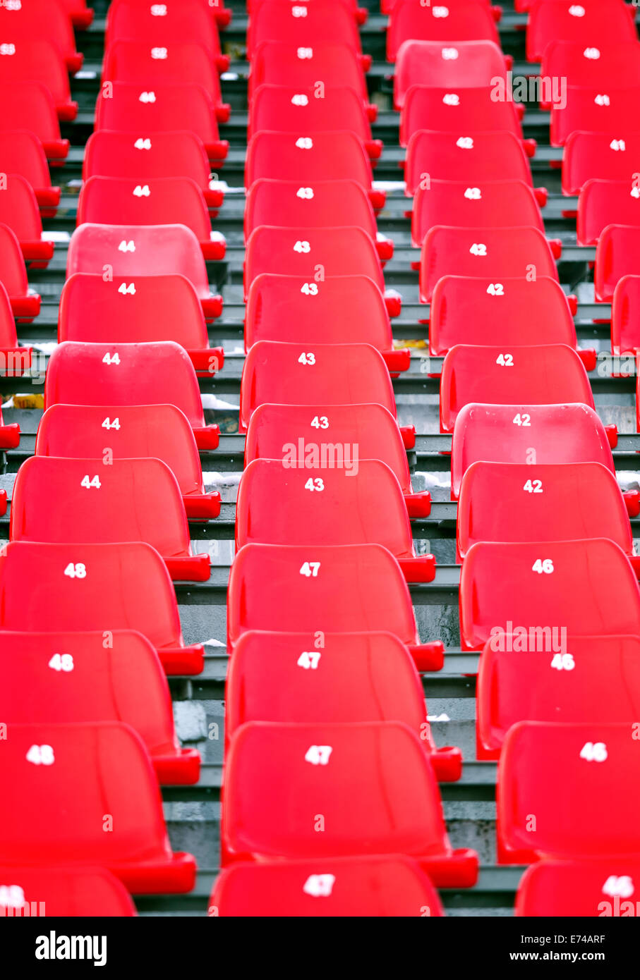 Empty red bleachers Stock Photo - Alamy