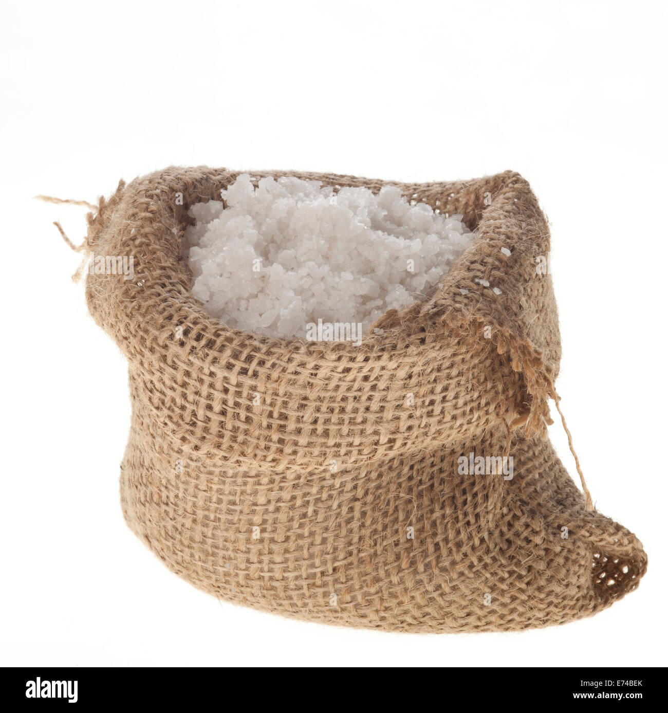 Sea salt in a jute sack on a white background Stock Photo - Alamy