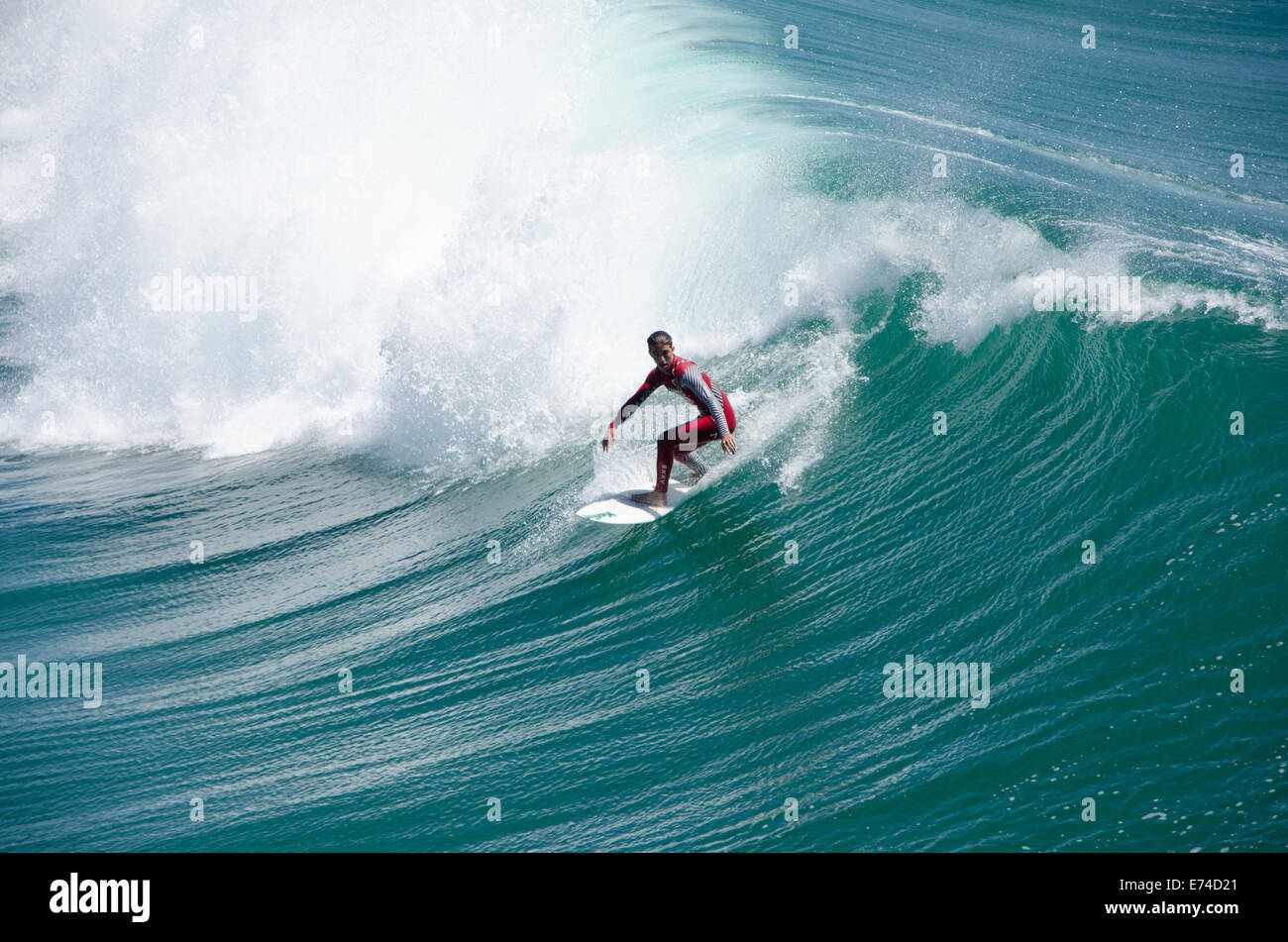 Surfer riding a wave Stock Photo - Alamy
