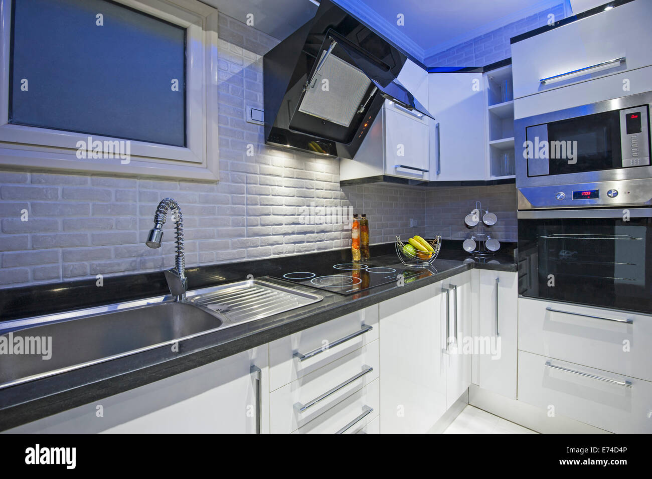 Interior design of luxury apartment kitchen area with cooker and oven ...