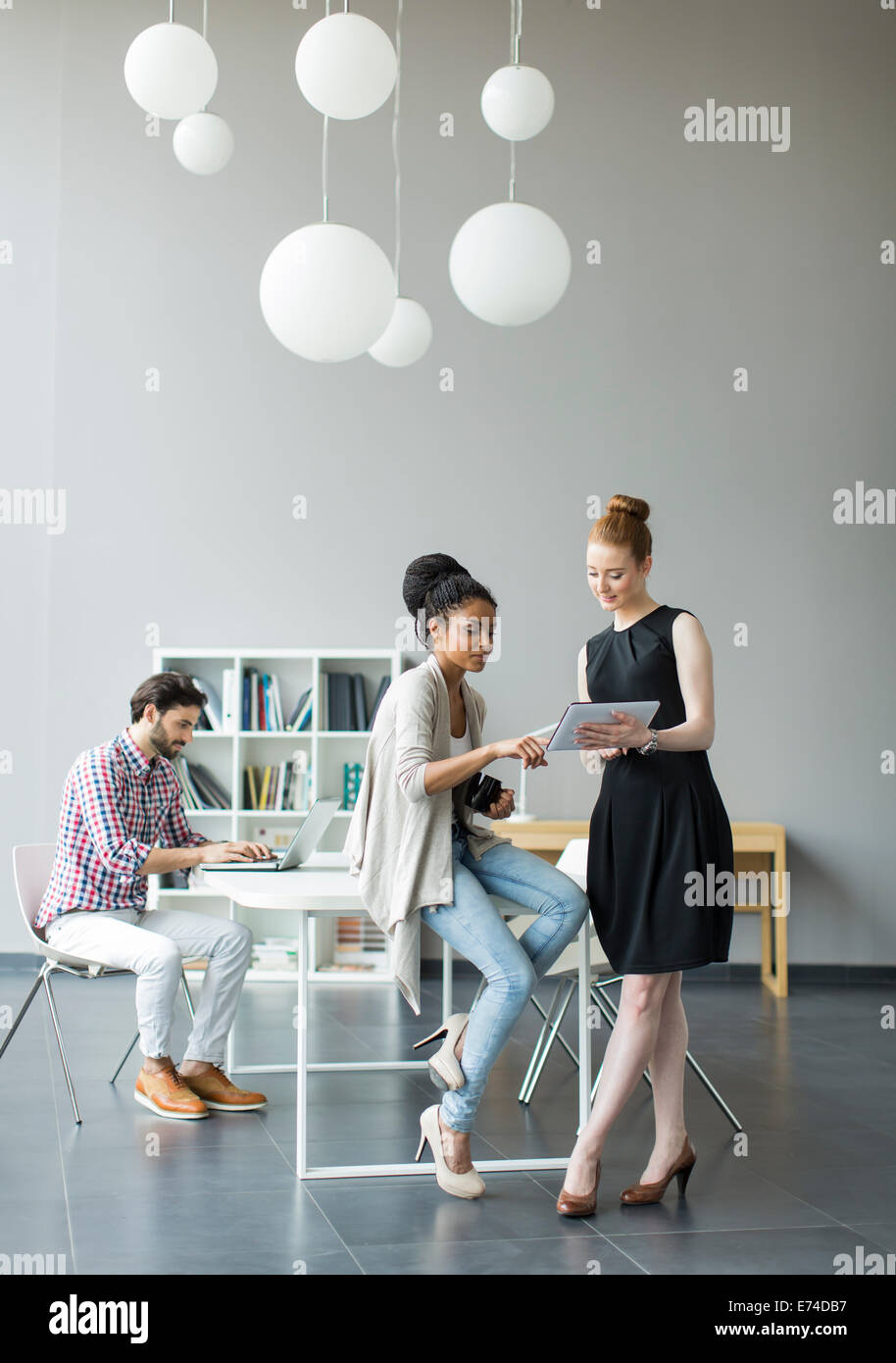 Young people in the office Stock Photo - Alamy