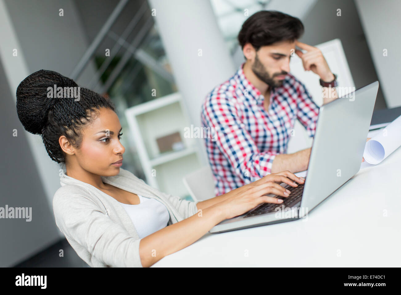 Young people in the office Stock Photo - Alamy