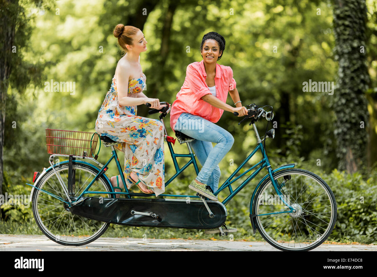 Two women on tandem bicycle hi-res stock photography and images - Alamy