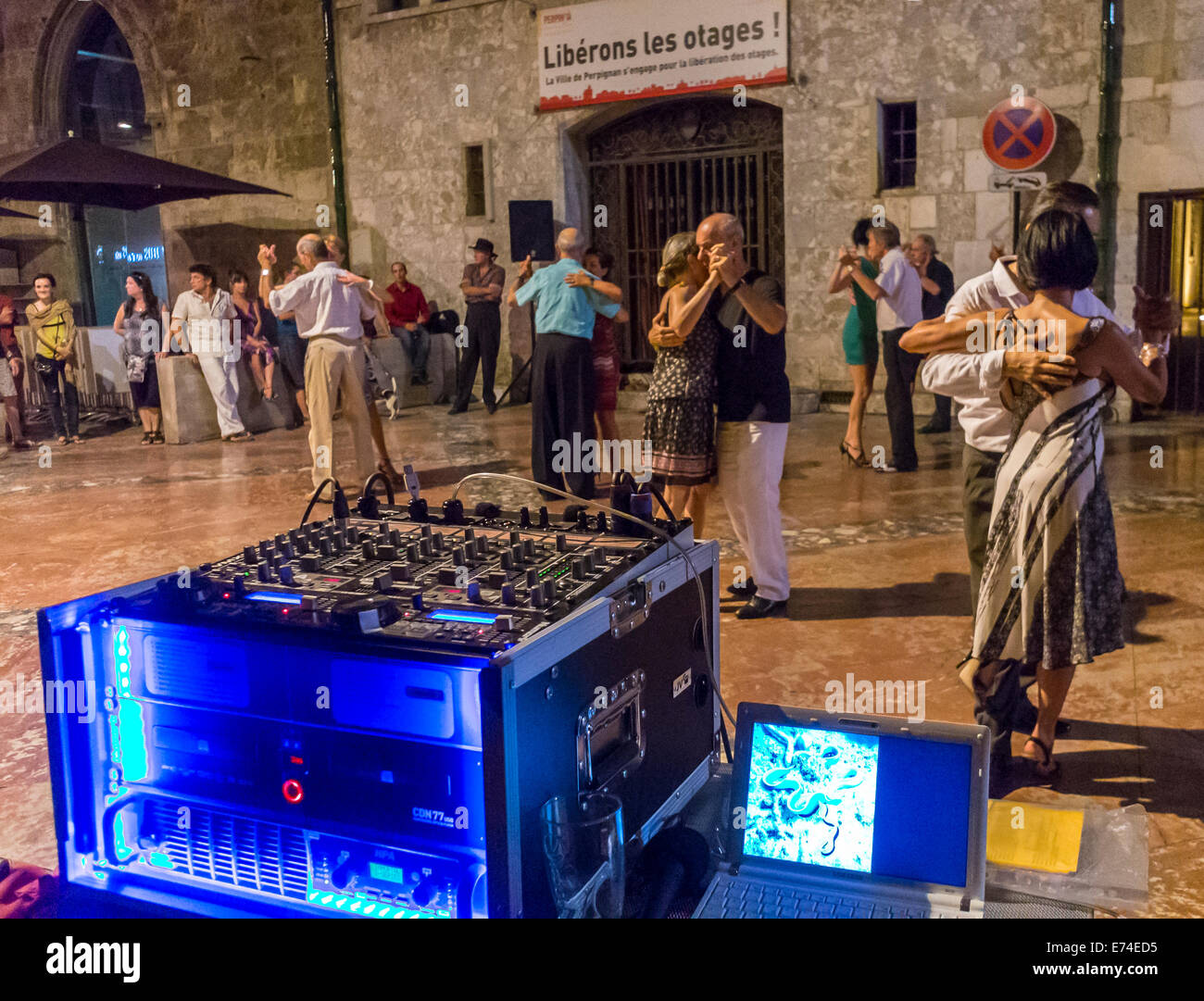 French senior couples dancing tango town square summer night ...