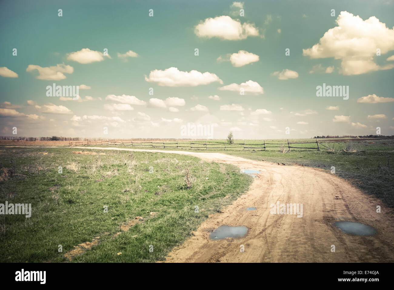 Sunny day in countryside. Empty rural road going through summer ...
