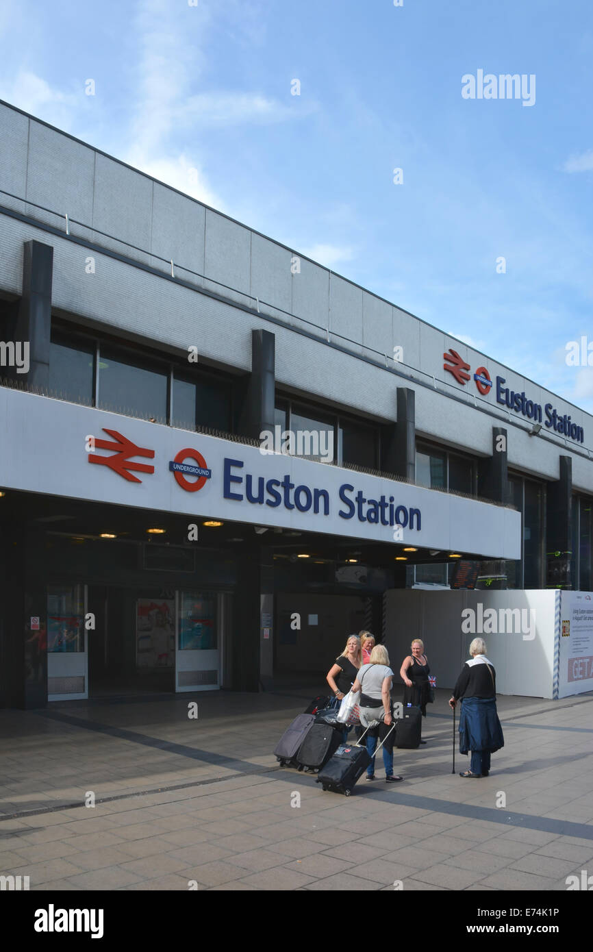 A small group of visitors meeting before a journey at the entrance to ...