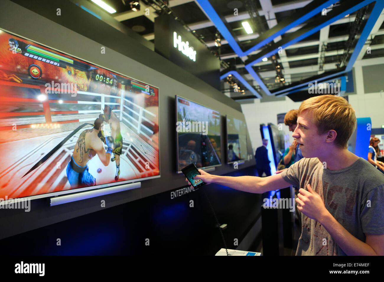 Berlin, Germany. 6th Sep, 2014. A visitor tries interactive television ...