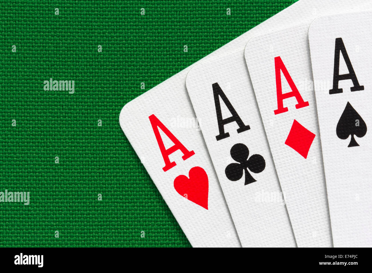 Four aces over green textile background. Close-up view Stock Photo - Alamy