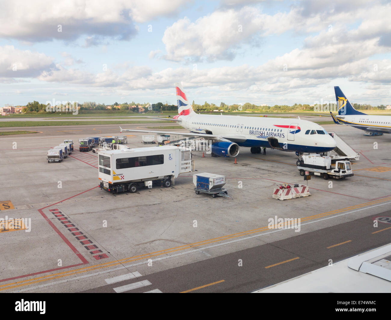 Disabled passengers boarding an aircraft via special mobile lift ...