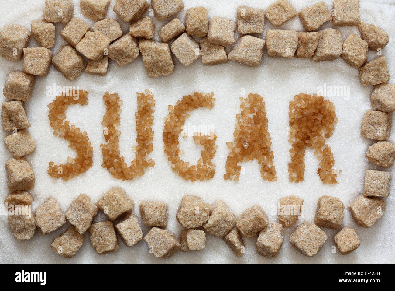 The word "sugar" written with sugar cane on white sugar background and ...