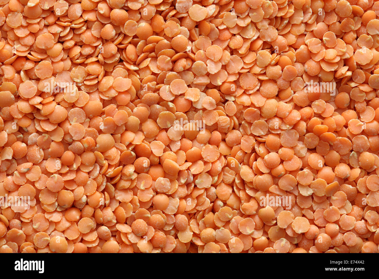 Red lentils background. Close-up Stock Photo - Alamy