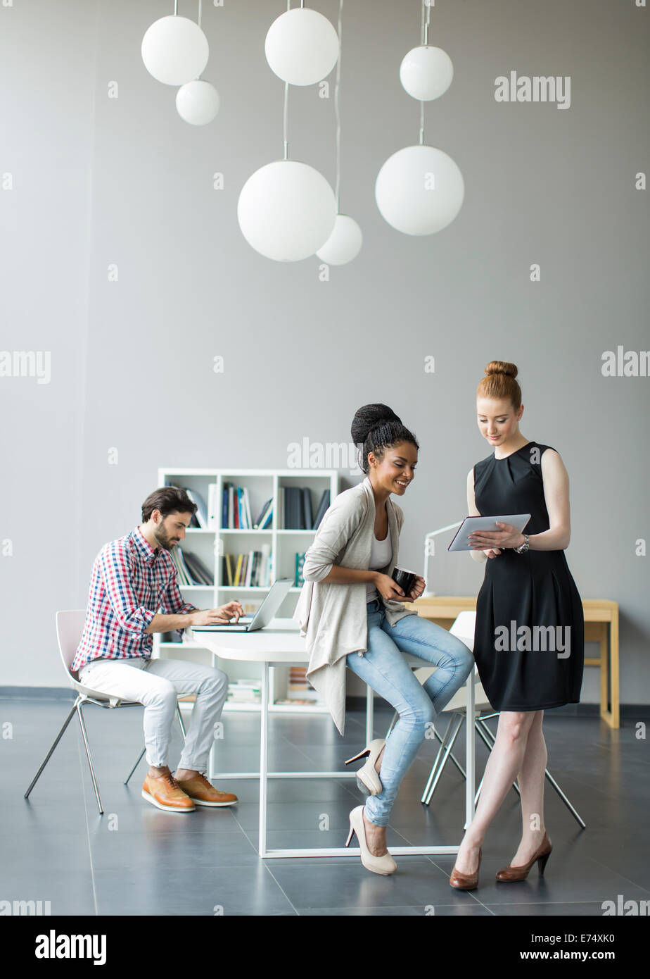 Young people in the office Stock Photo - Alamy