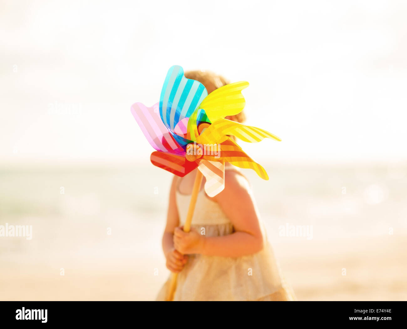 Baby holding windmill hi-res stock photography and images - Alamy