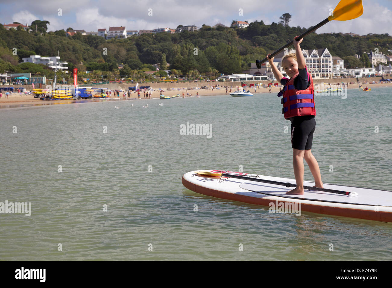 Girl paddle boarding hi-res stock photography and images - Alamy